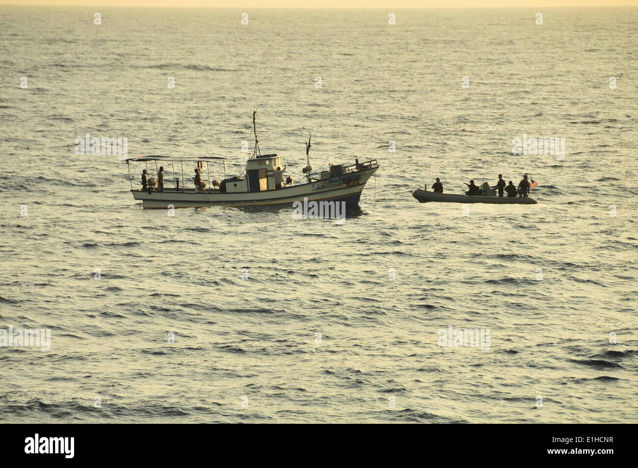 U.S. Sailors and Coast Guardsmen assigned to frigate USS Elrod (FFG 55 ...