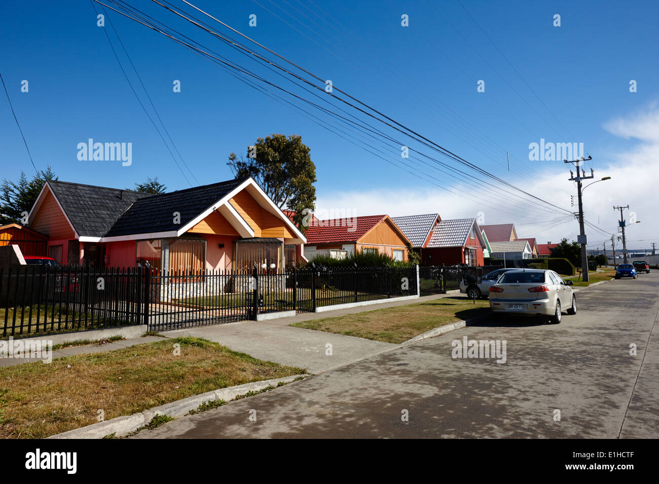street of modern typical chilean construction house with tiled roofs ...