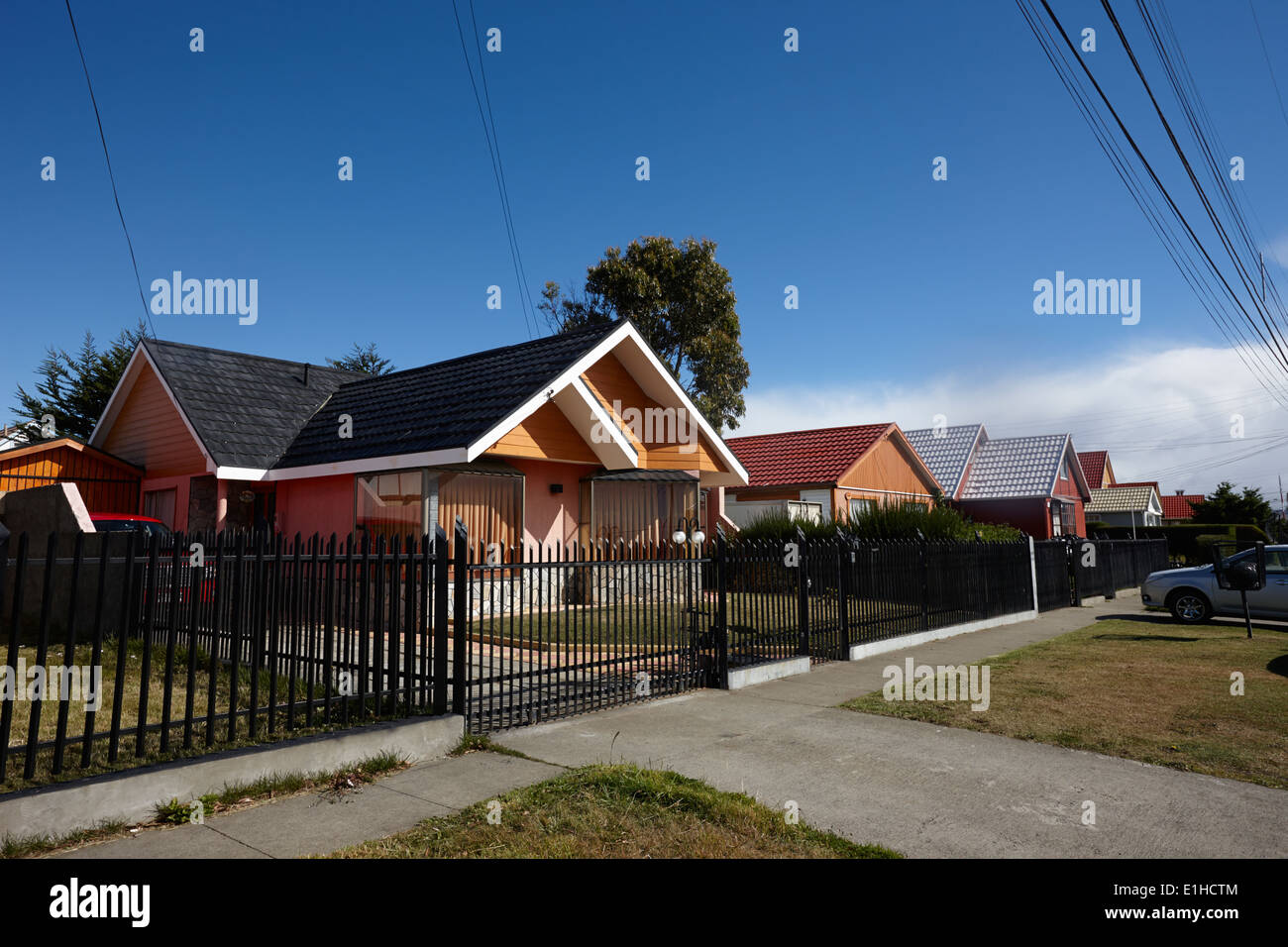 street of modern typical chilean construction house with tiled roofs ...