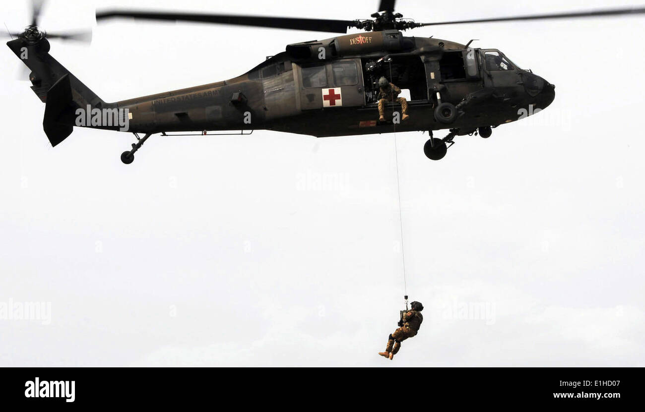U.S. Army Spc. Mark Jordan, an UH-60 Black Hawk helicopter crew chief ...