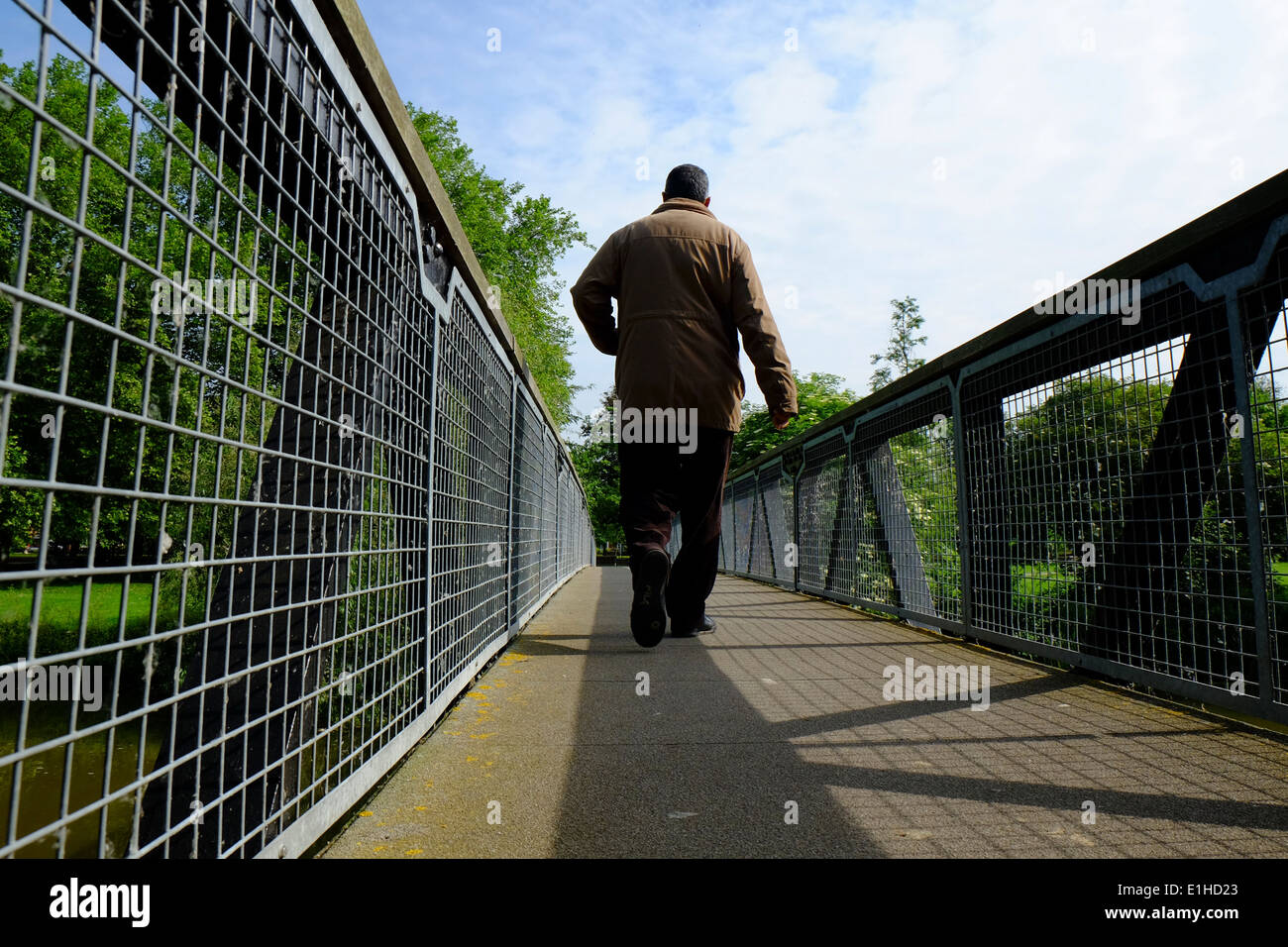 Man Crossing Footbridge High Resolution Stock Photography and Images ...