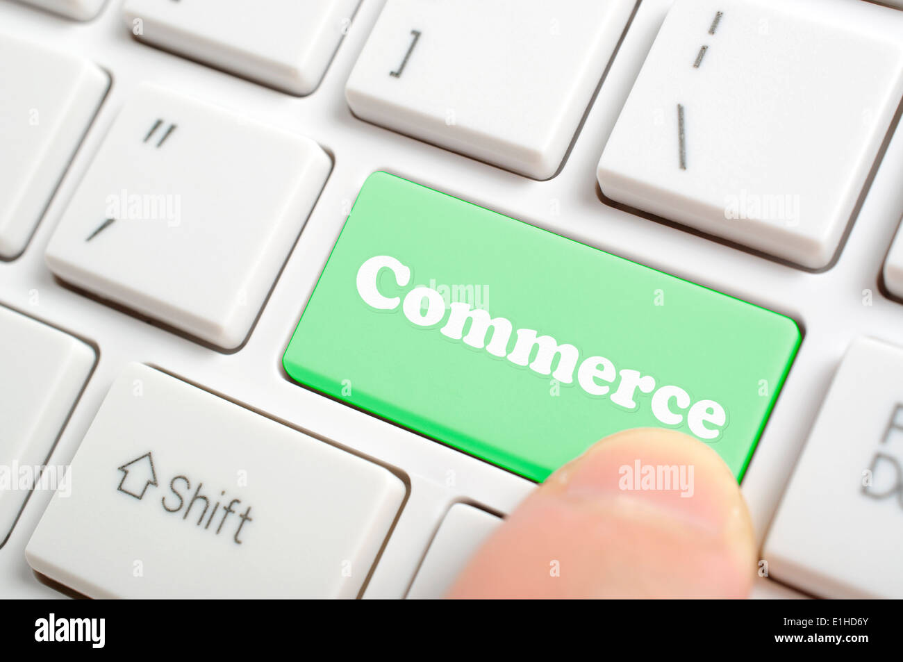Pressing commerce key on keyboard Stock Photo - Alamy