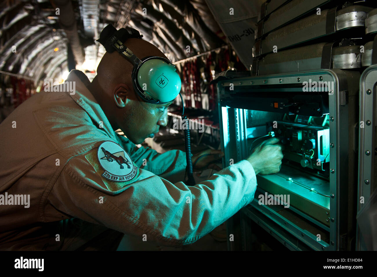 Airman 1st Class Nate Hammond adjusts the frequency of the Roll-On ...