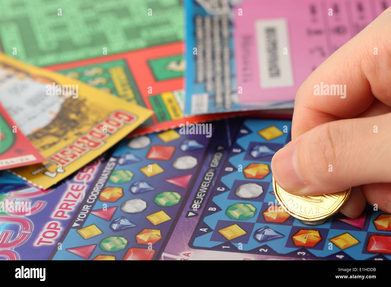 Scratching lottery tickets Stock Photo - Alamy