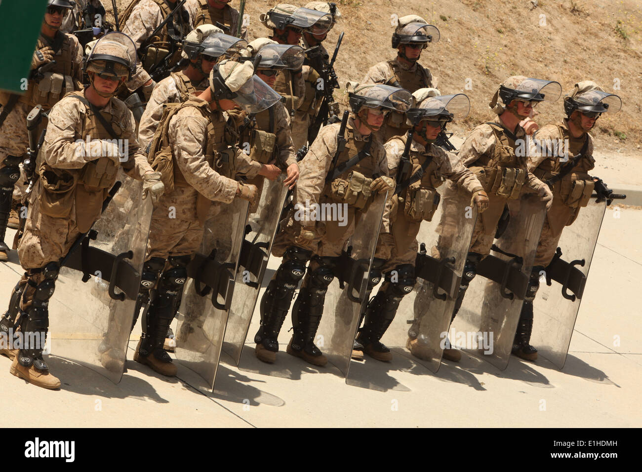 U.S. Marine Maritime Raid Force controls a simulated rioting crowd ...