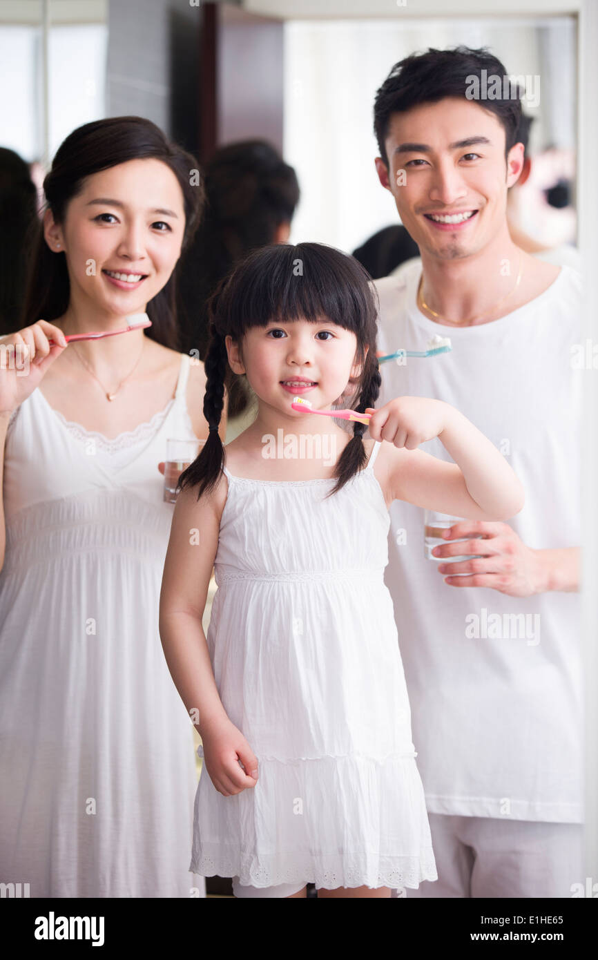 Happy family brushing teeth Stock Photo - Alamy