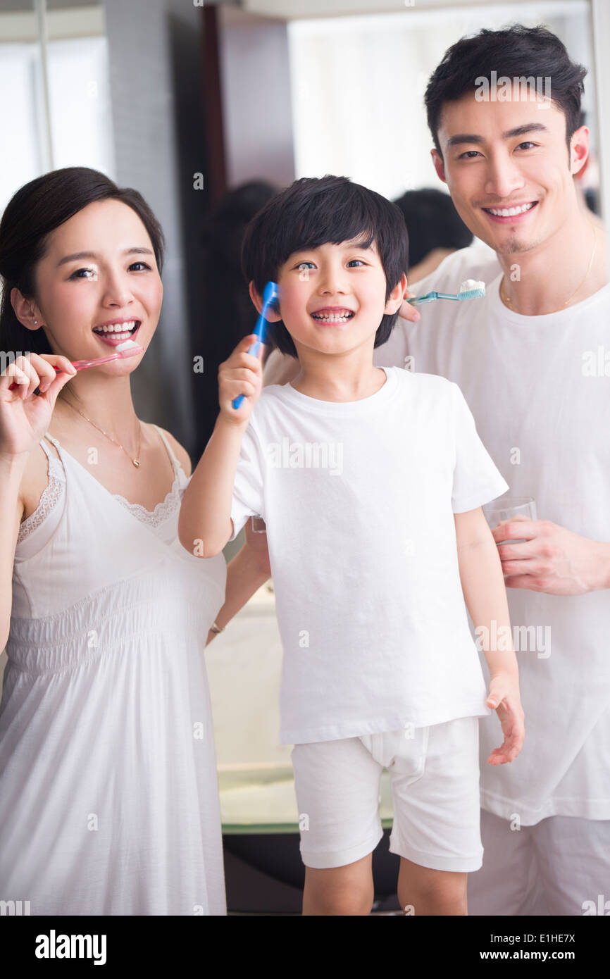Happy family brushing teeth Stock Photo - Alamy