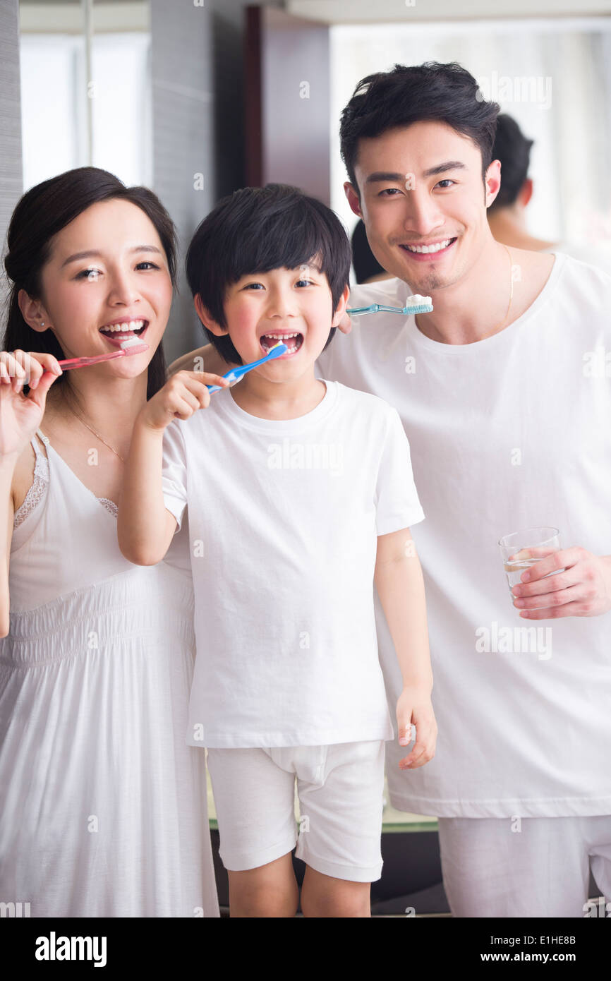 Happy family brushing teeth Stock Photo - Alamy