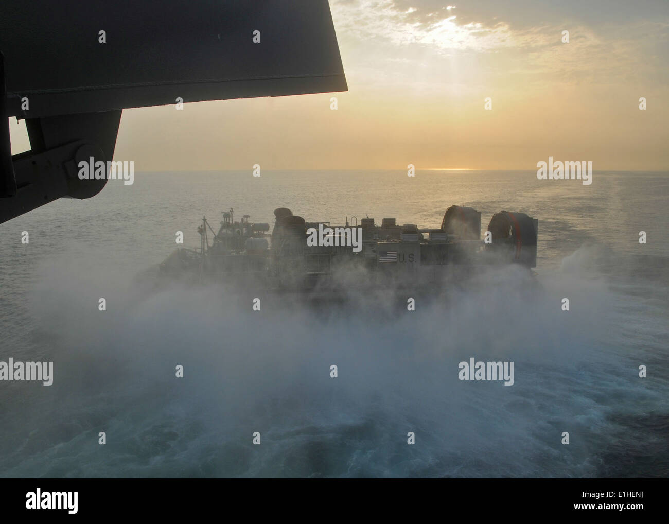 A U.S. Navy landing craft, air cushion departs the well deck of the ...