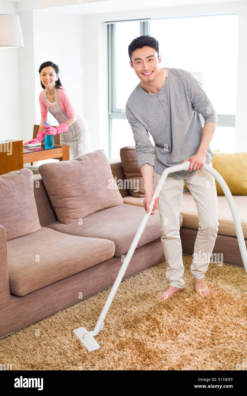 Couple doing house chores hi-res stock photography and images - Alamy