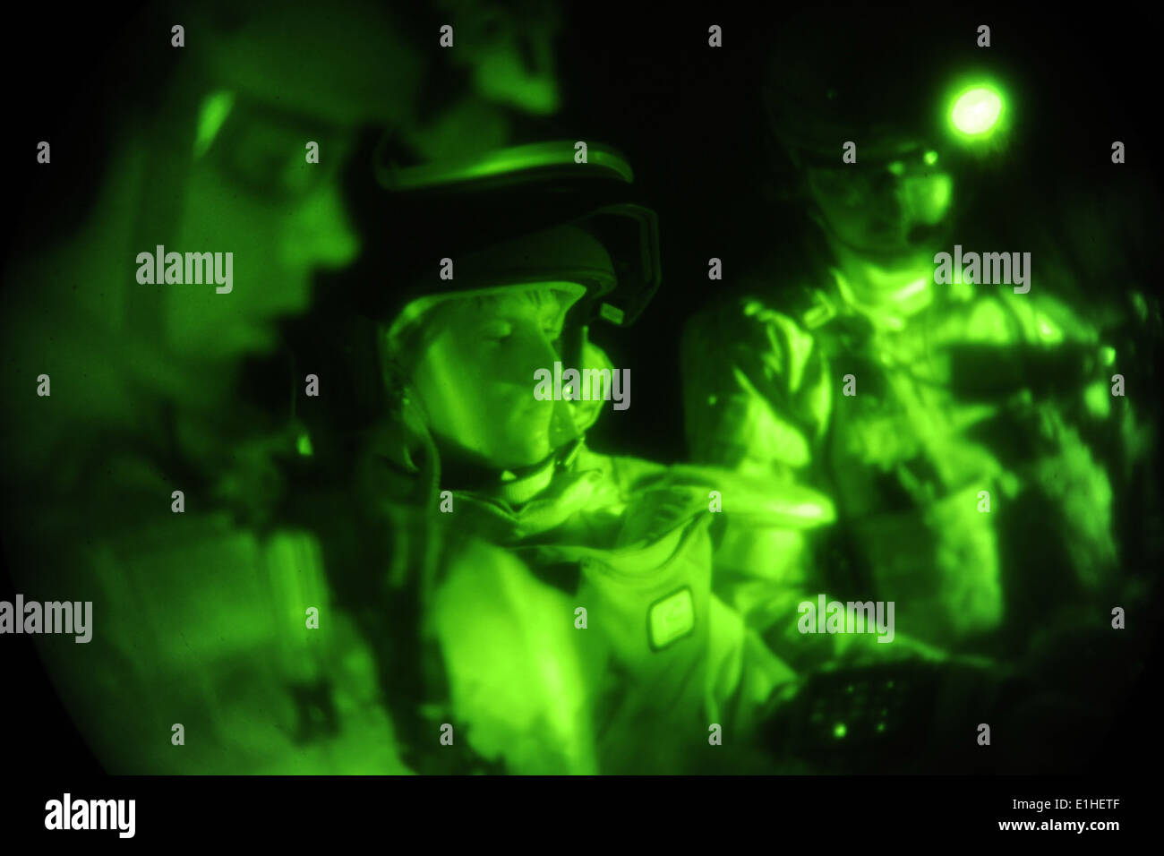 U.S. Navy explosive ordnance disposal (EOD) technicians carry out a ...