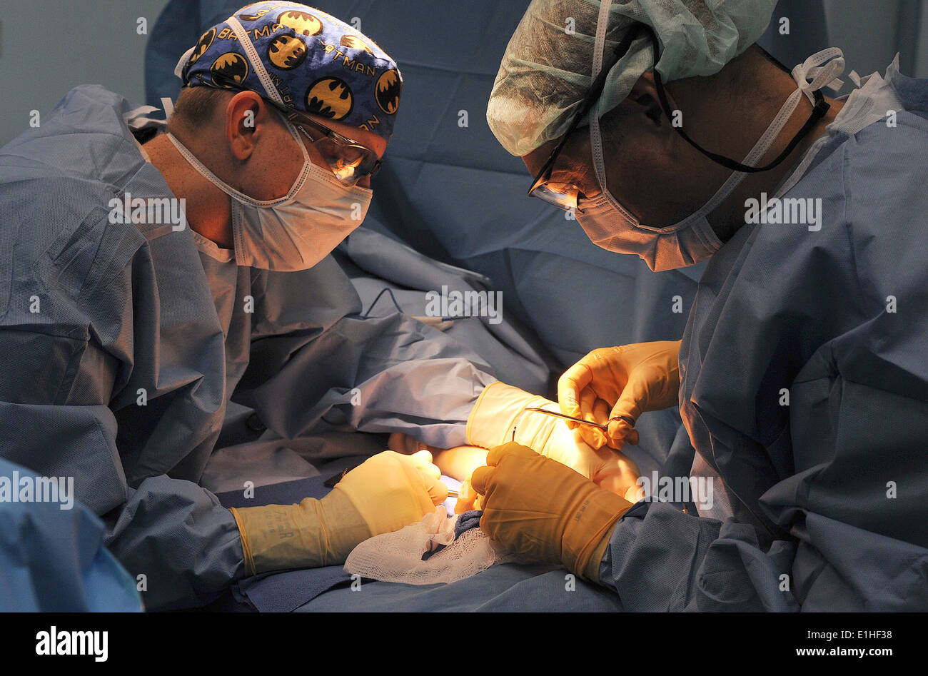 U.S. Navy Cmdr. Matthew Provencher, right, the director of surgical ...