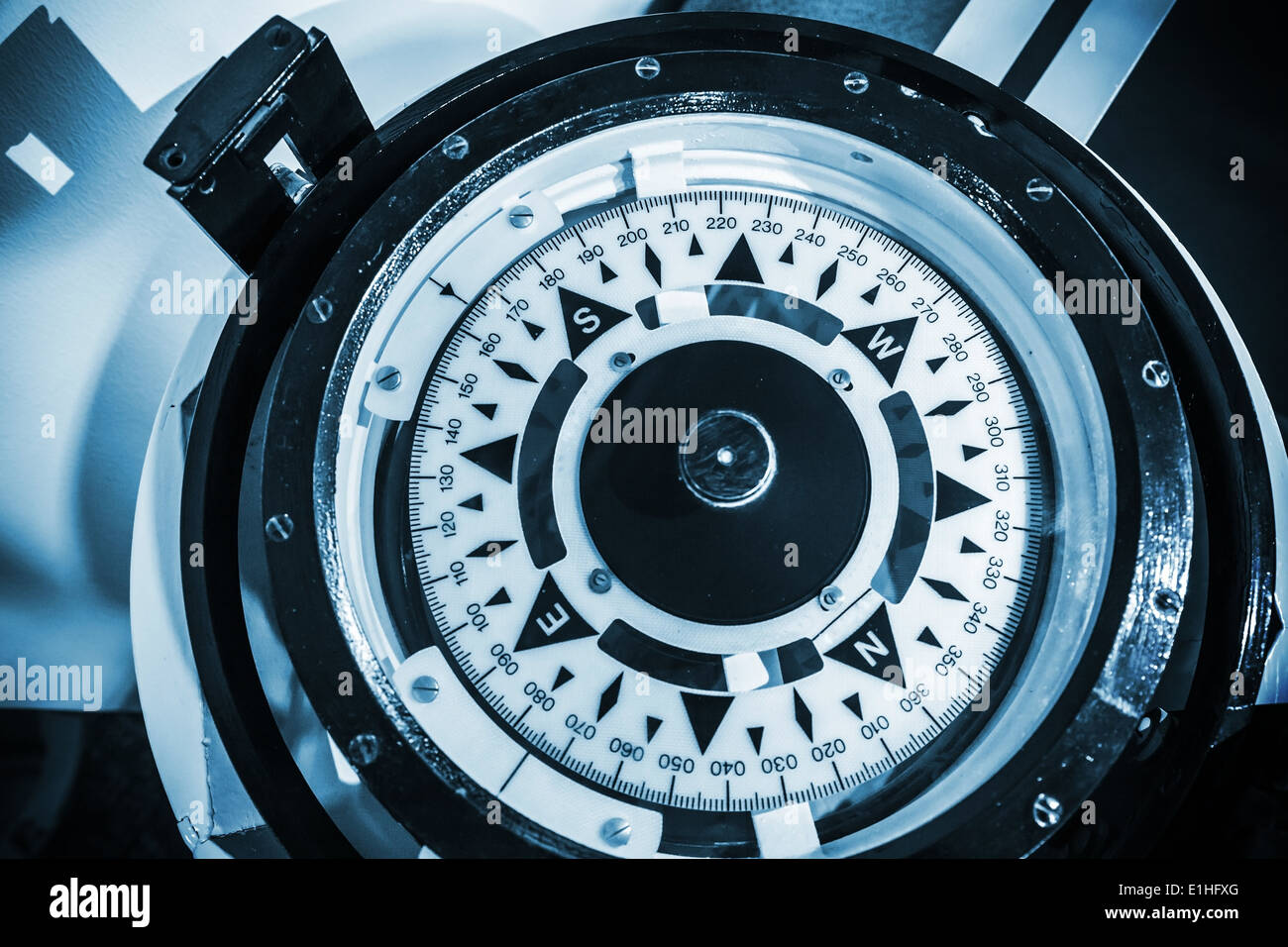 Naval compass. Blue toned monochrome close-up photo Stock Photo - Alamy