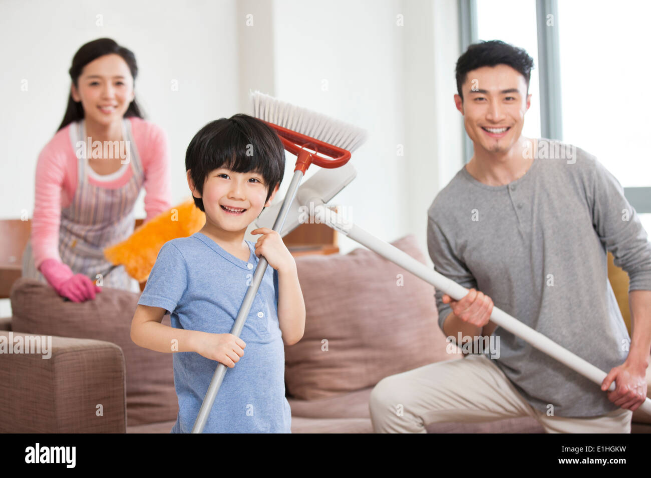Family doing chores hi-res stock photography and images - Alamy