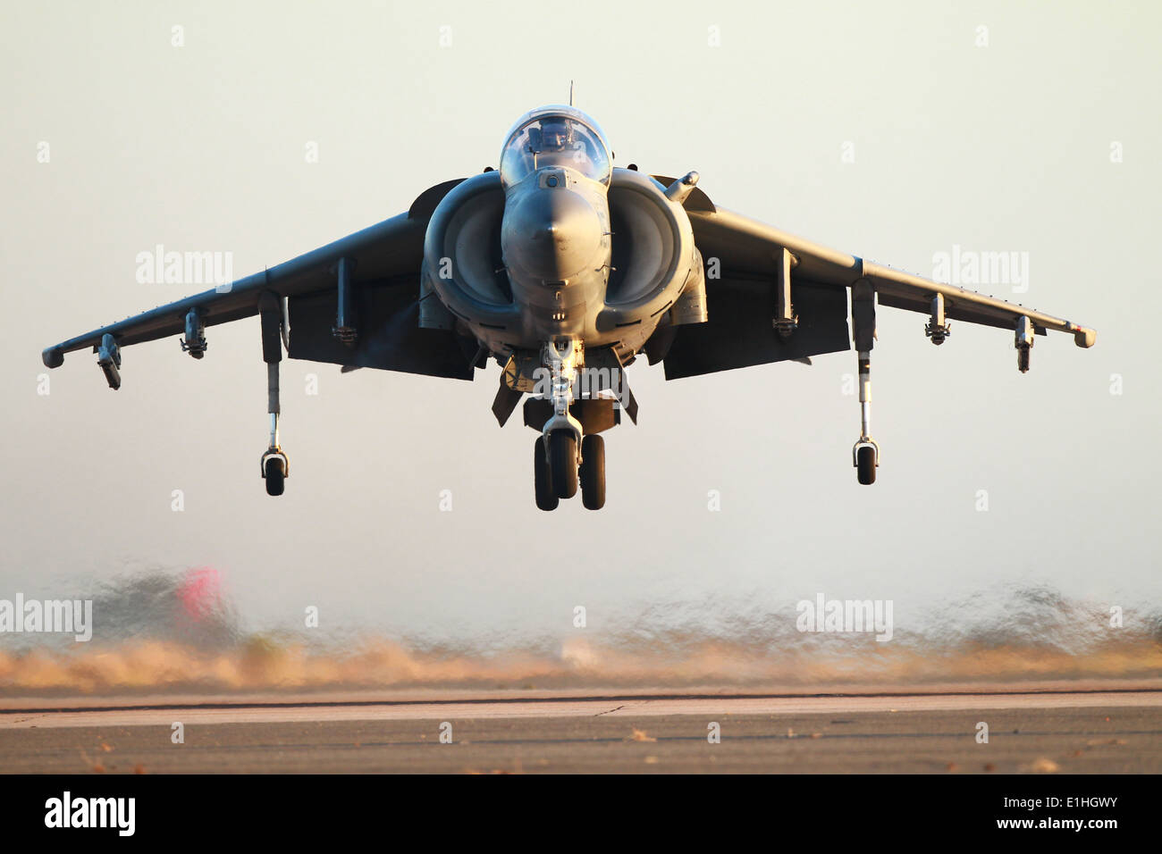 A AV-8B Harrier hovers over the flight line during the Marine Corps ...