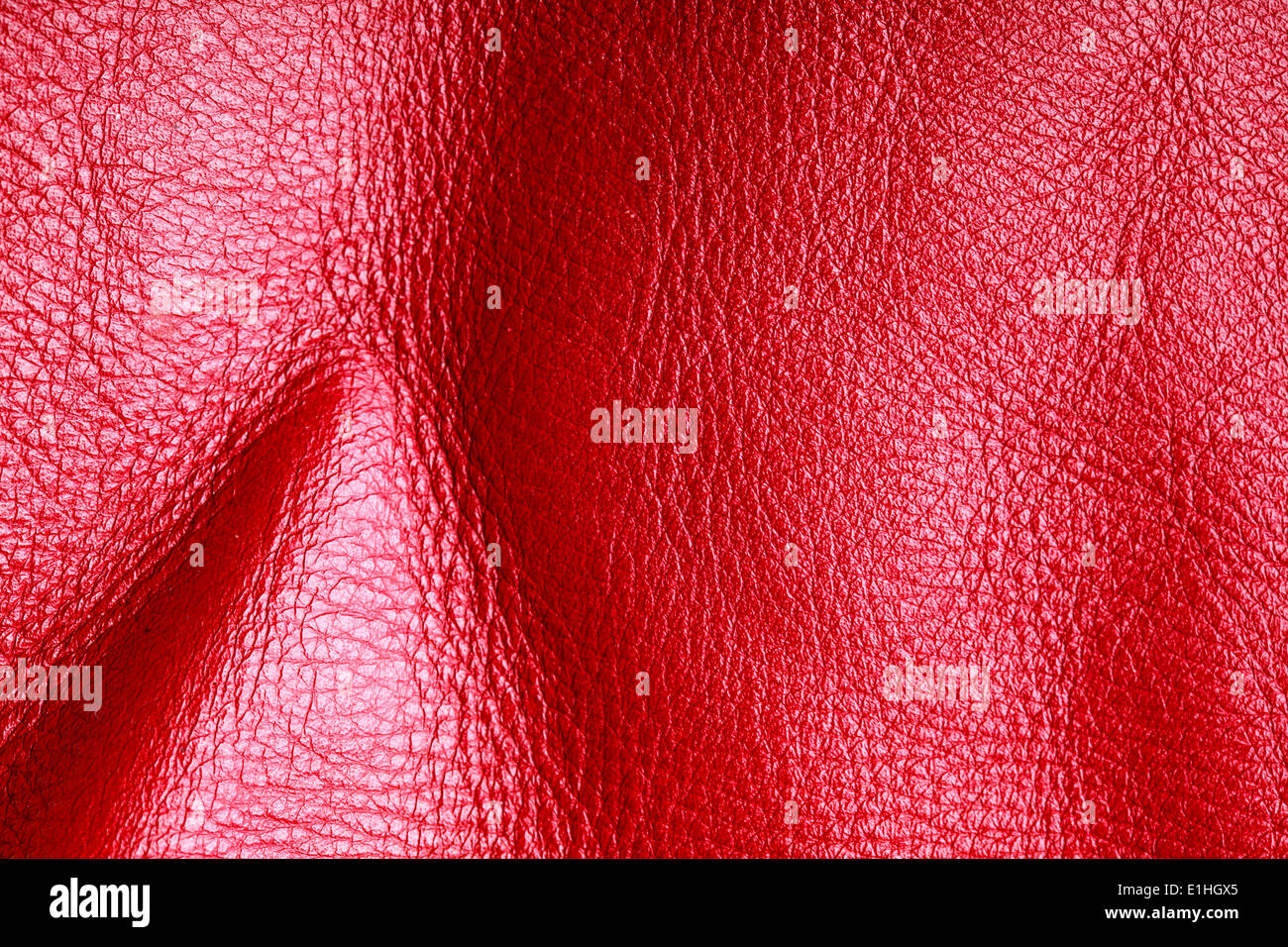 Texture of folds vivid red skin leather background Stock Photo - Alamy