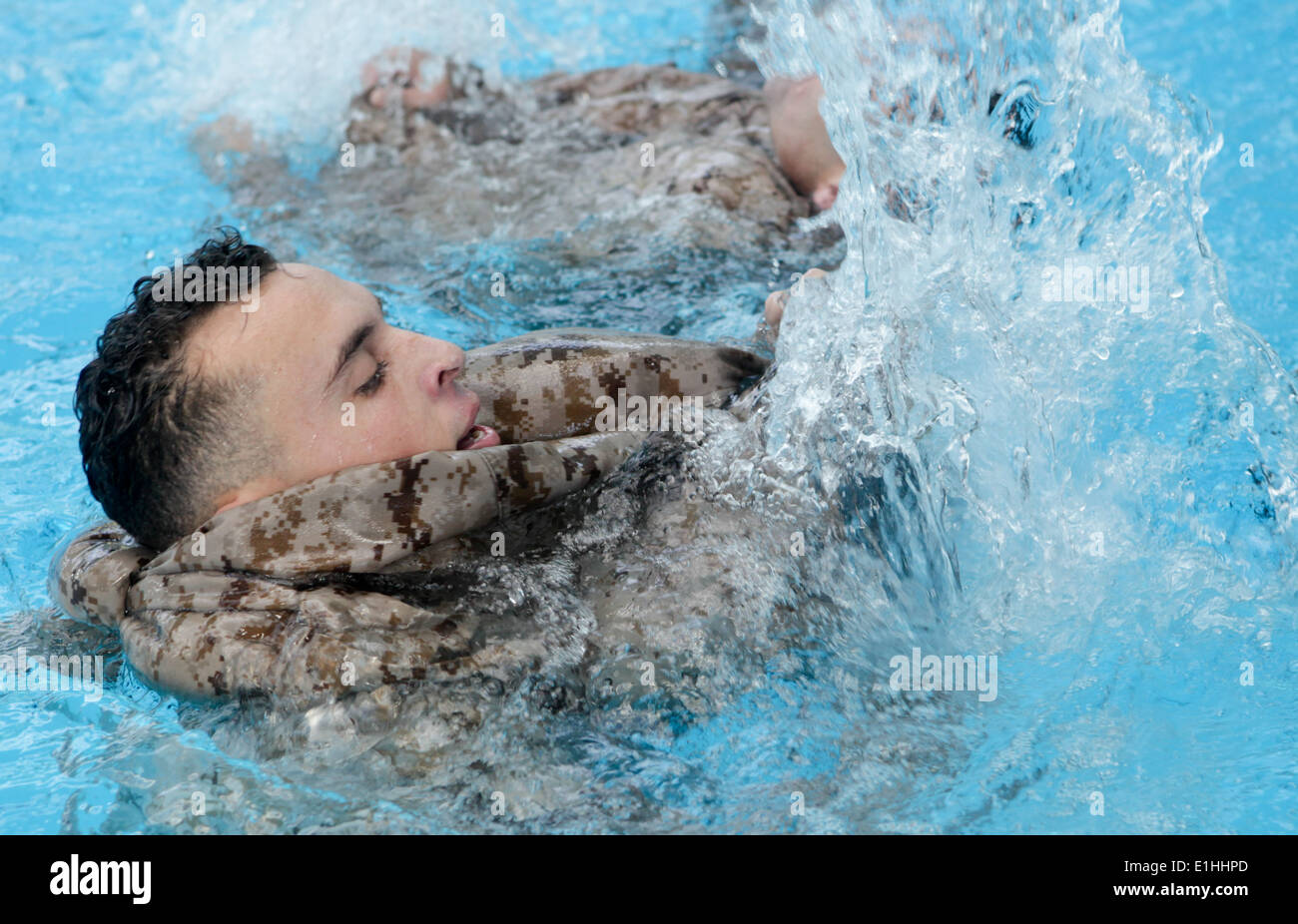 Cpl. Andy Rodriguez Diaz splashes water to try and inflate his trousers ...
