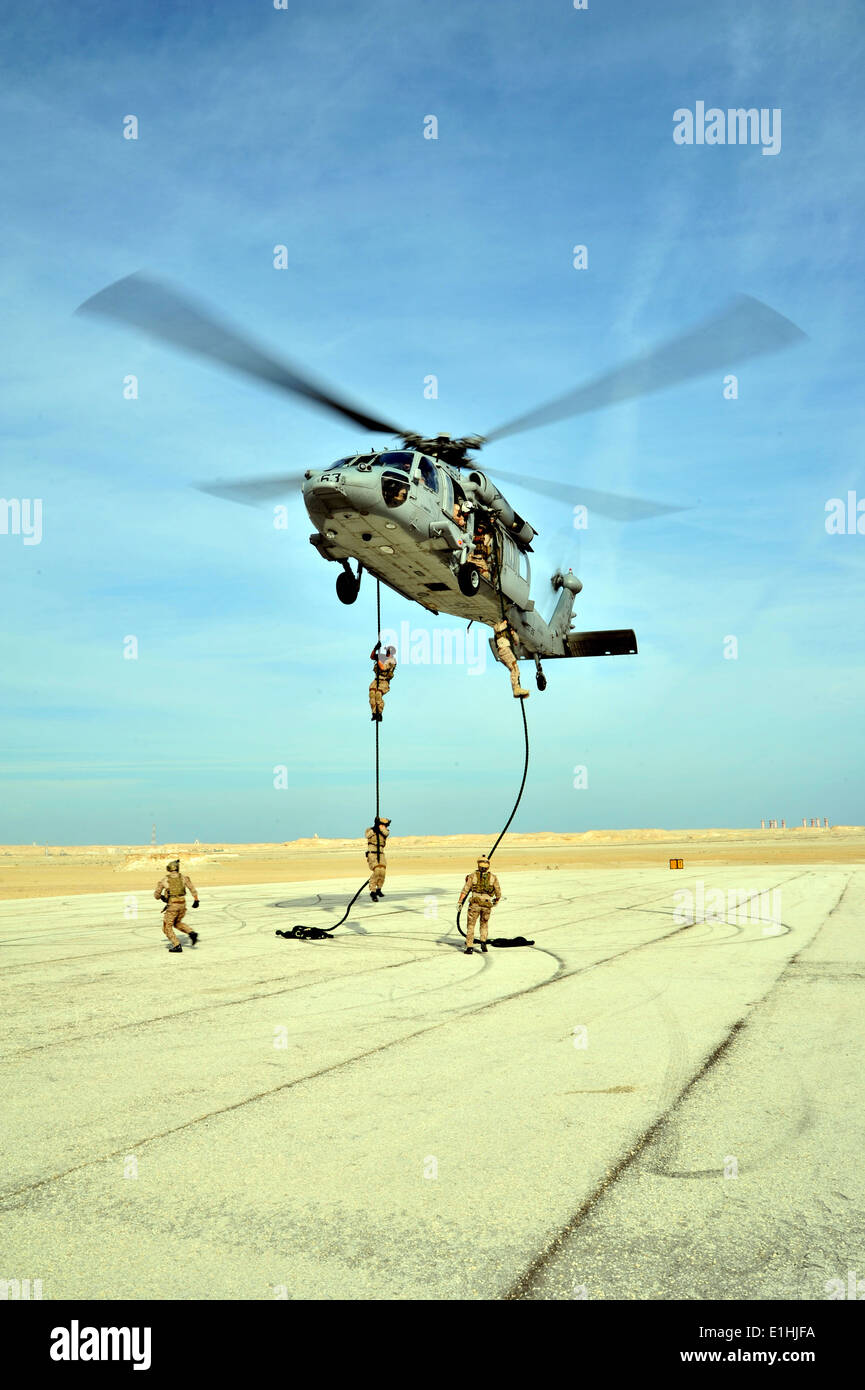 U.S. Navy Special Warfare Operators with SEAL Team 5 fast rope during ...