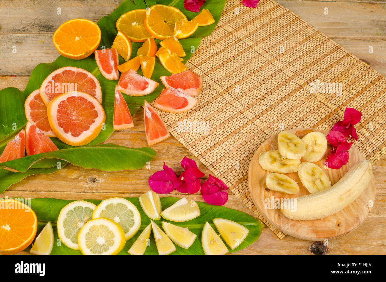 Assorted fruit on a rustic table setting Stock Photo - Alamy