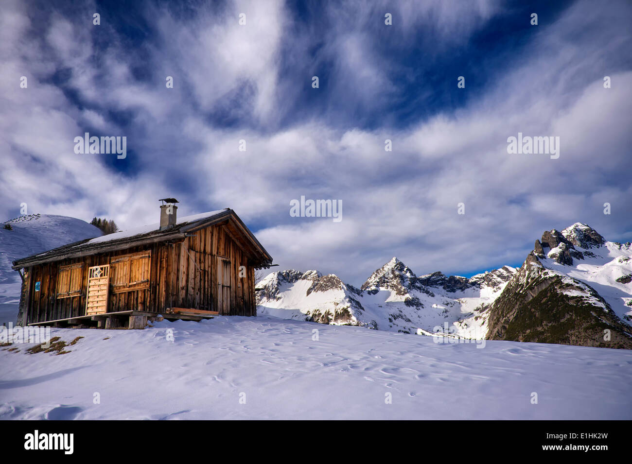Alpine hut in a mountain landscape in winter, Bach, Lechtal valley ...