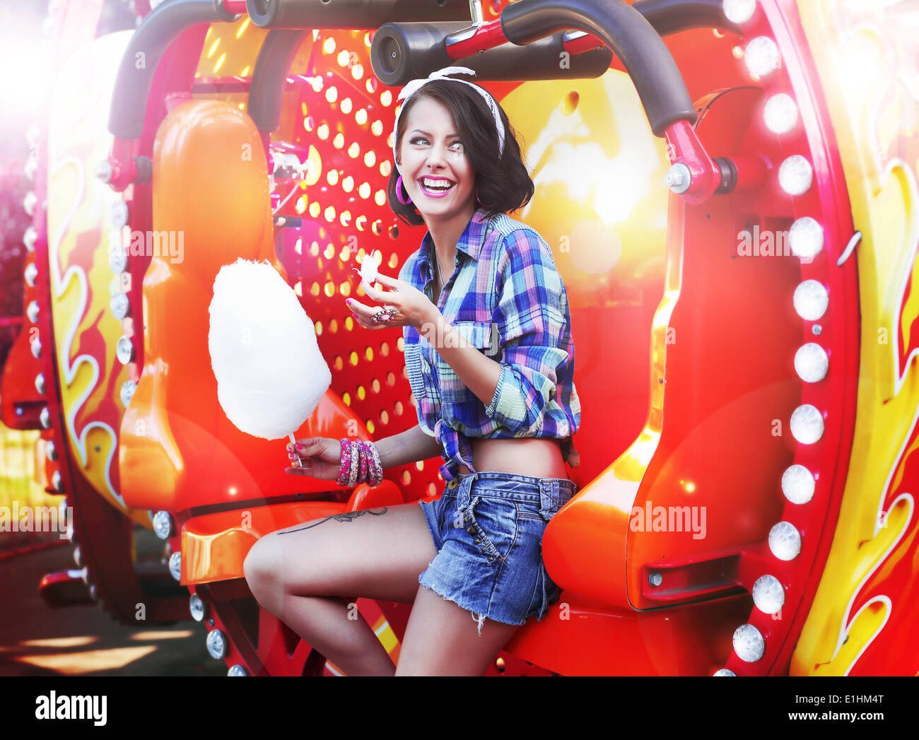 Lifestyle. Young Happy Woman Eating Sweetened Cotton Candy in Funfair ...