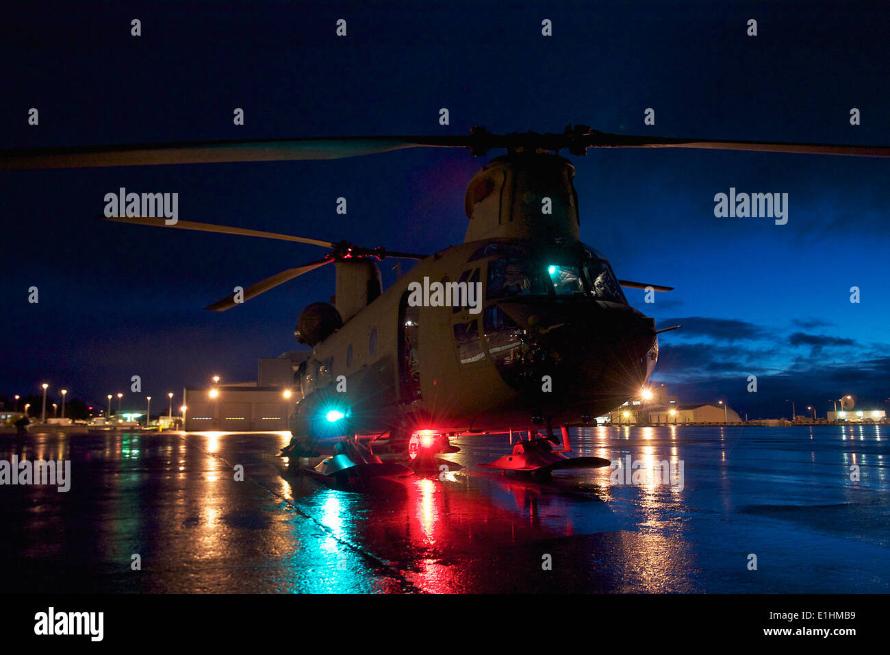 U.S. Army flight crew members prepare a CH-47F Chinook helicopter from ...