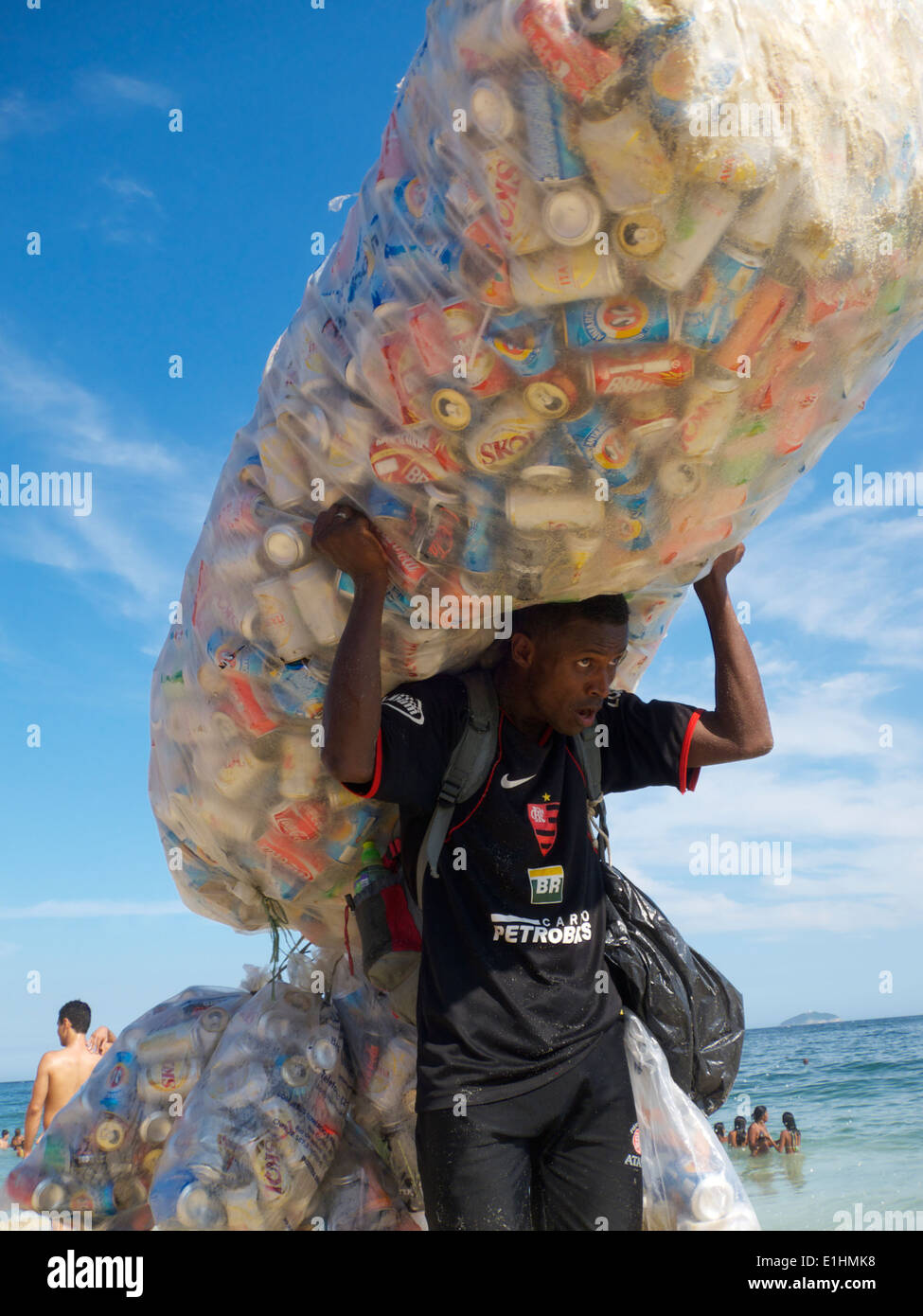 RIO DE JANEIRO, BRAZIL - JANUARY 25, 2014: Brazilian man carries a ...