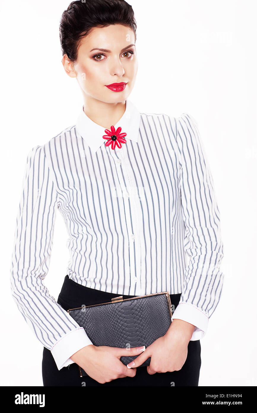 Strict beauty woman fashion model with notepad posing Stock Photo - Alamy