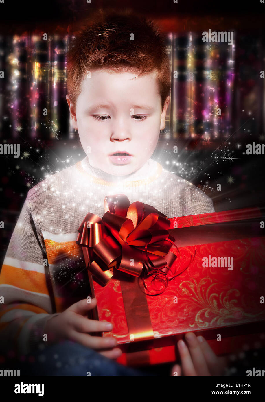 Birthday - lovely excited little red hair kid looking happily into red ...