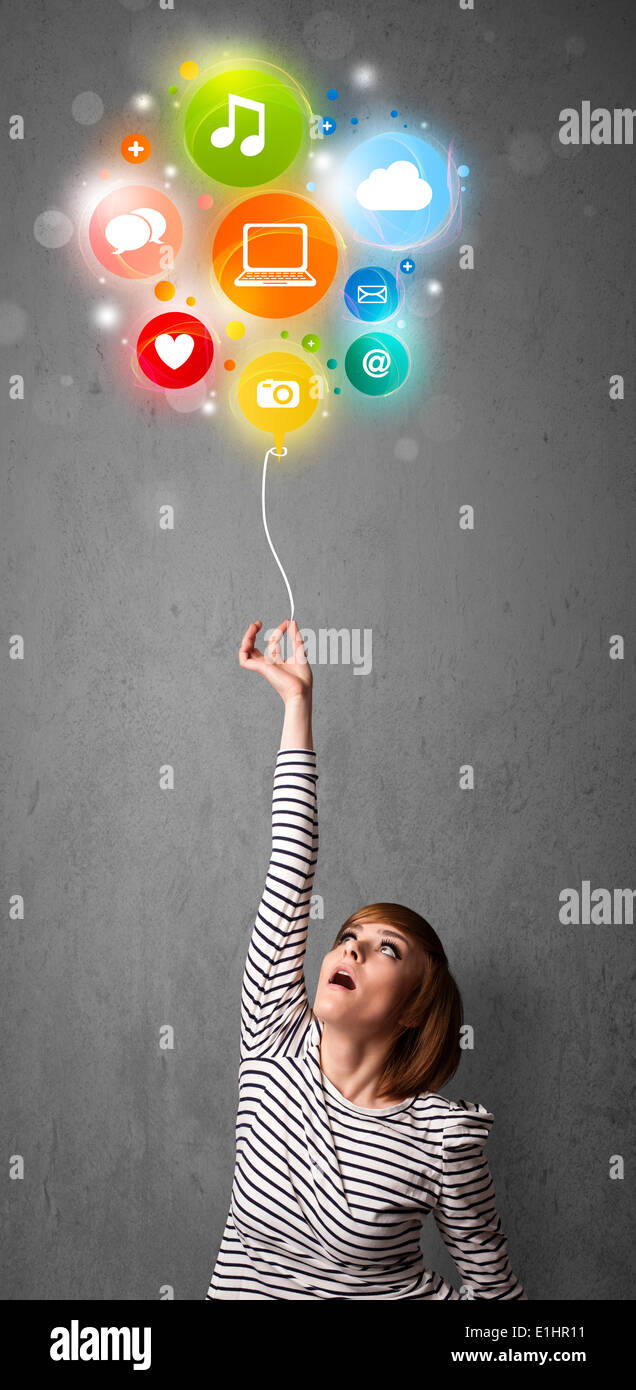 Woman holding social media balloon Stock Photo - Alamy