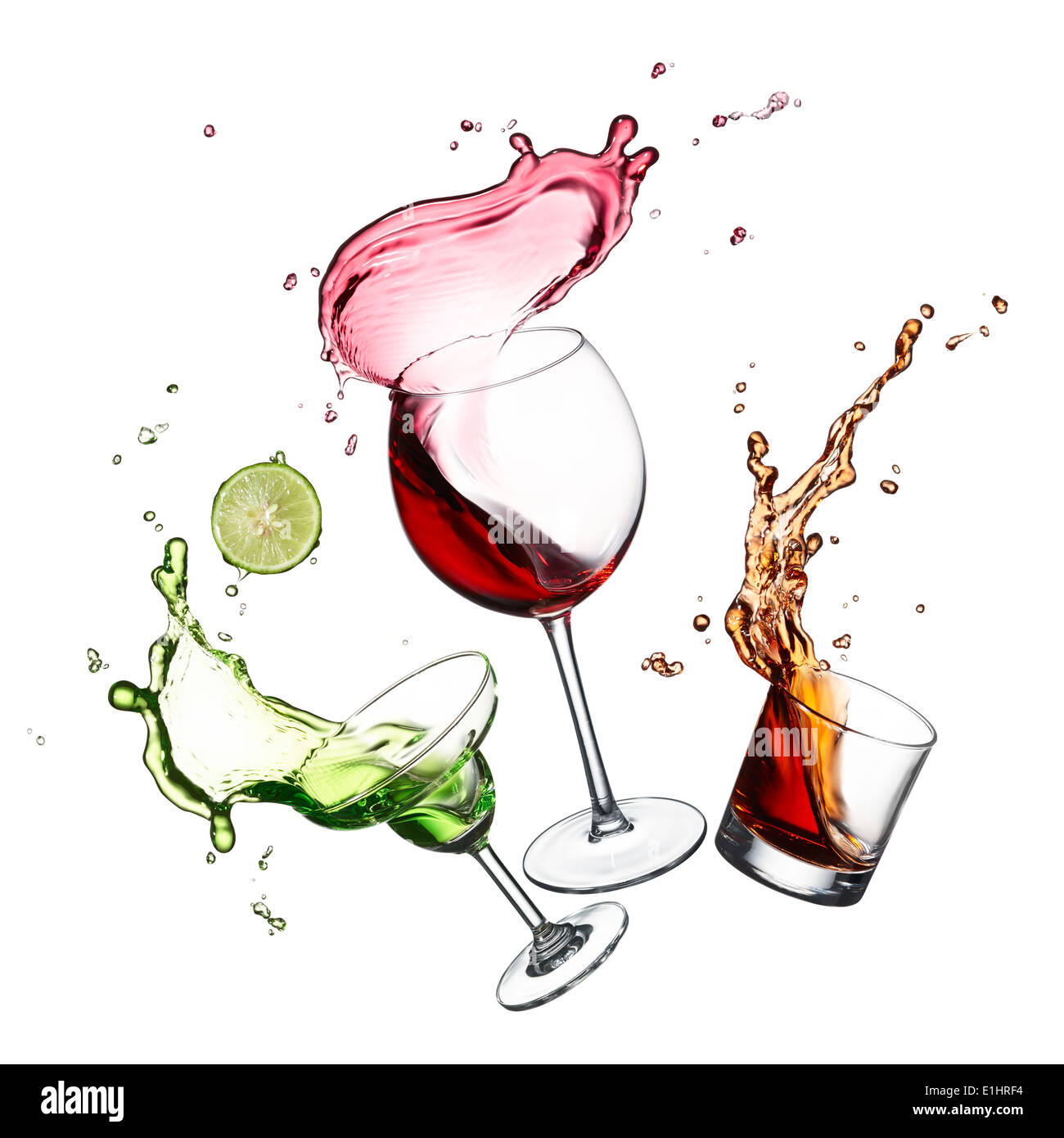 three glasses of splashing red wine, cocktail and whiskey Stock Photo ...