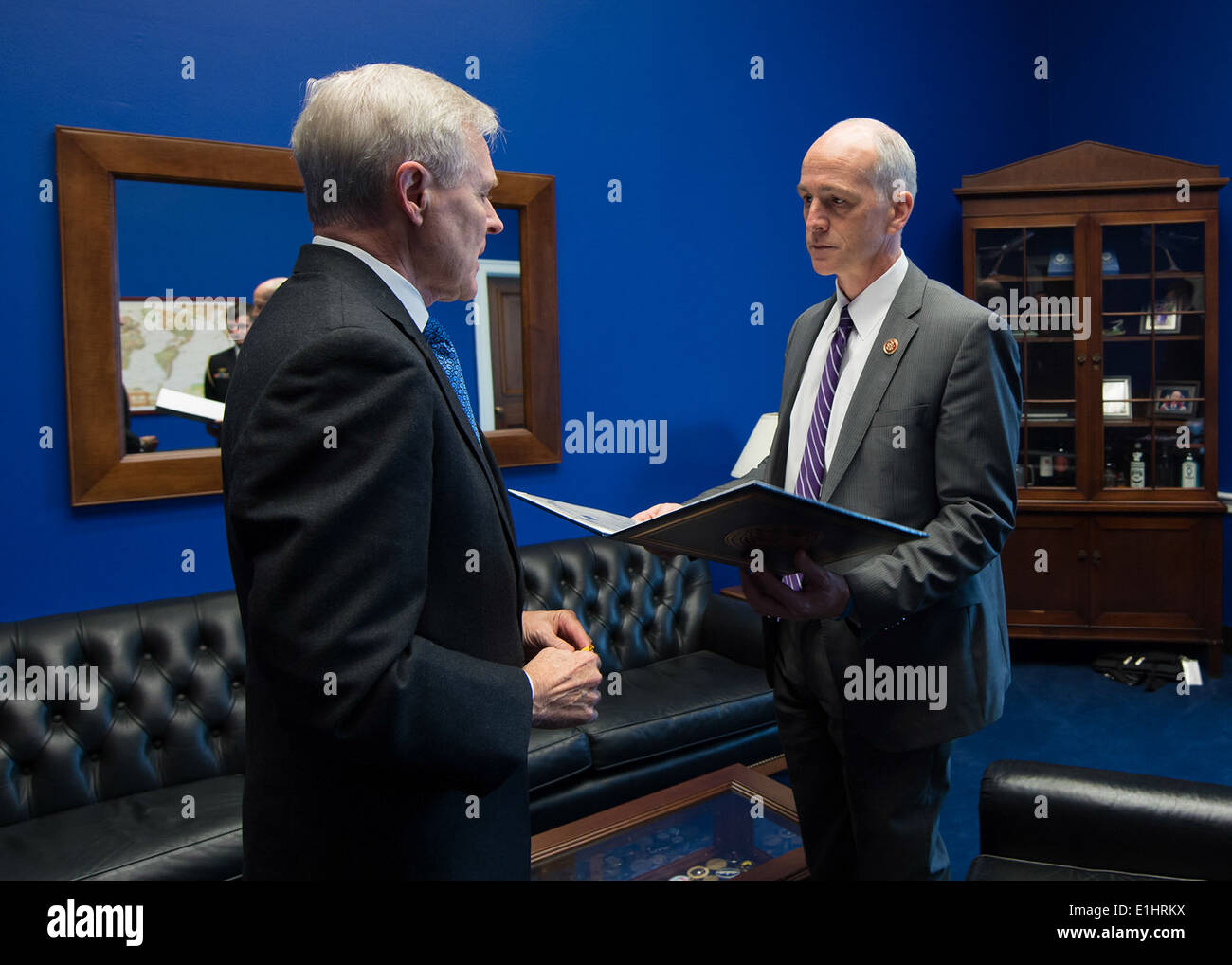 Secretary of the Navy Ray Mabus, left, presents a Navy Distinguished ...