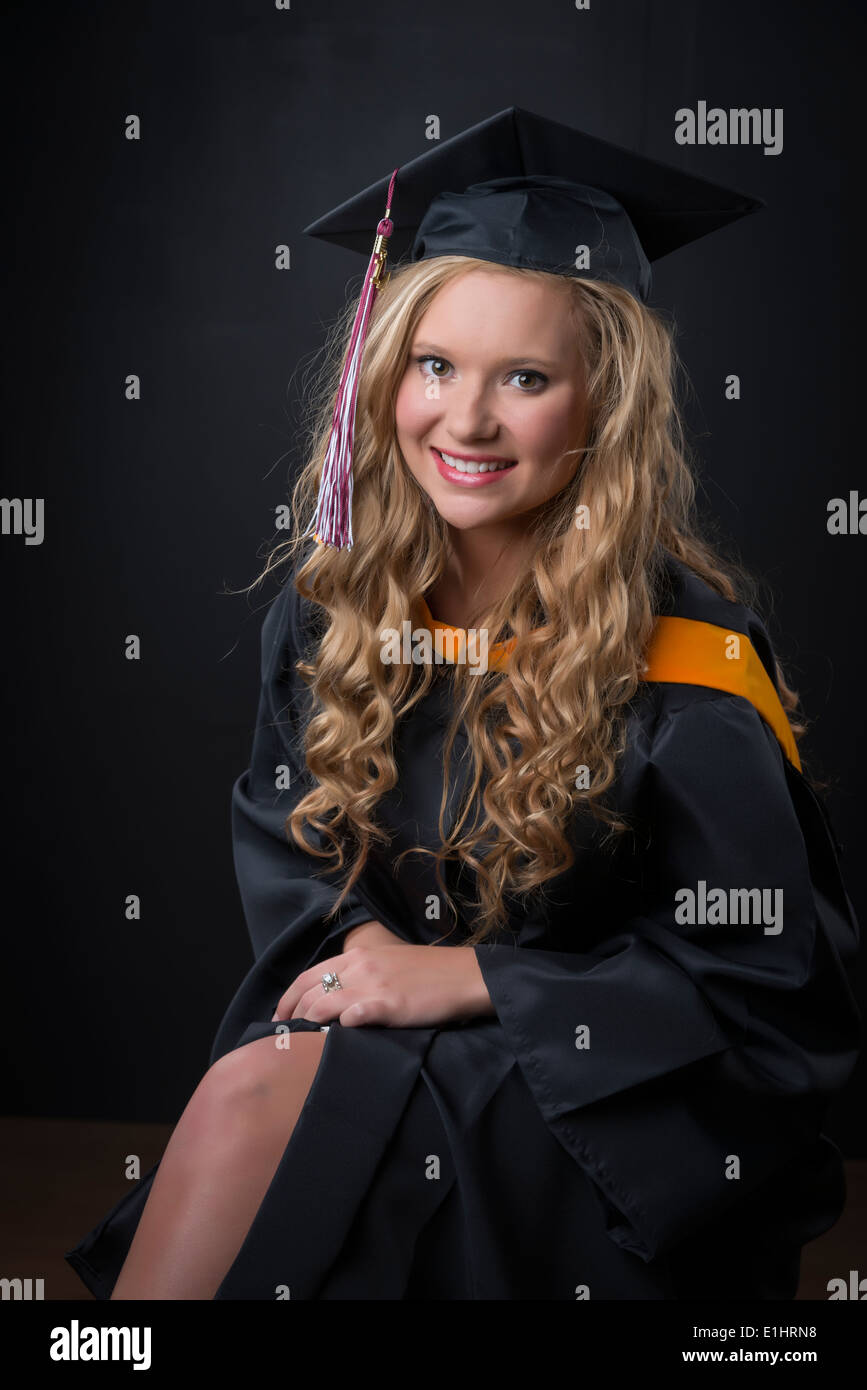 Portrait of young female graduate wearing mortarboard Stock Photo - Alamy