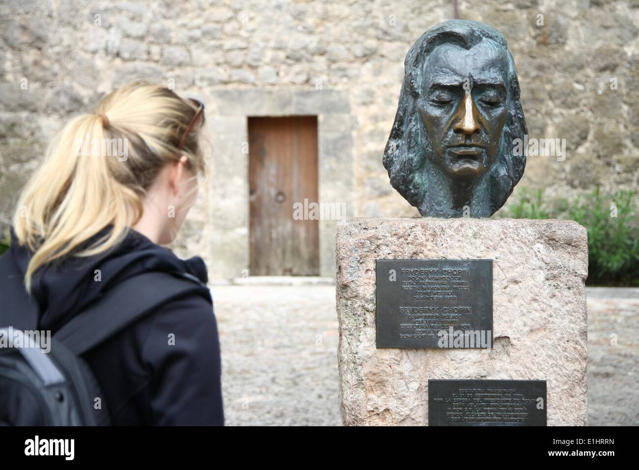 Majorca, Spain. 8th May, 2014. A young woman examines a bust of pianist ...
