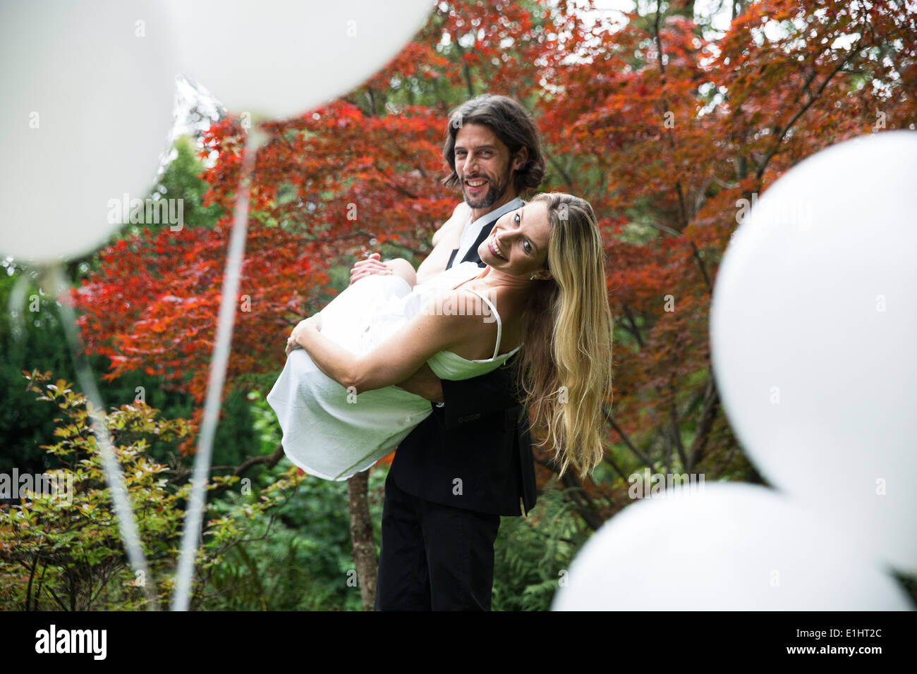 Newly married couple groom carrying hi-res stock photography and images ...