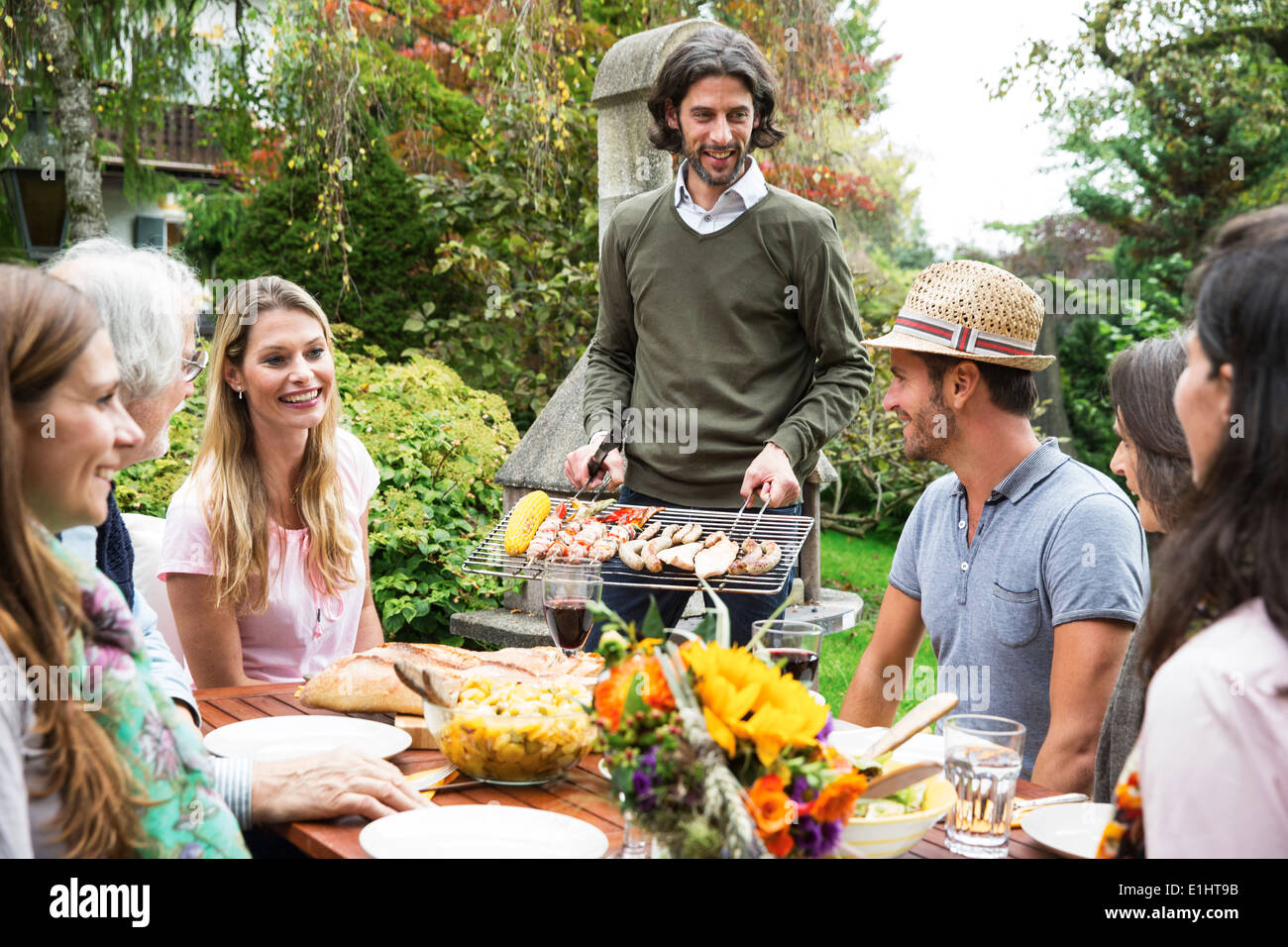 People on a barbecue Stock Photo - Alamy