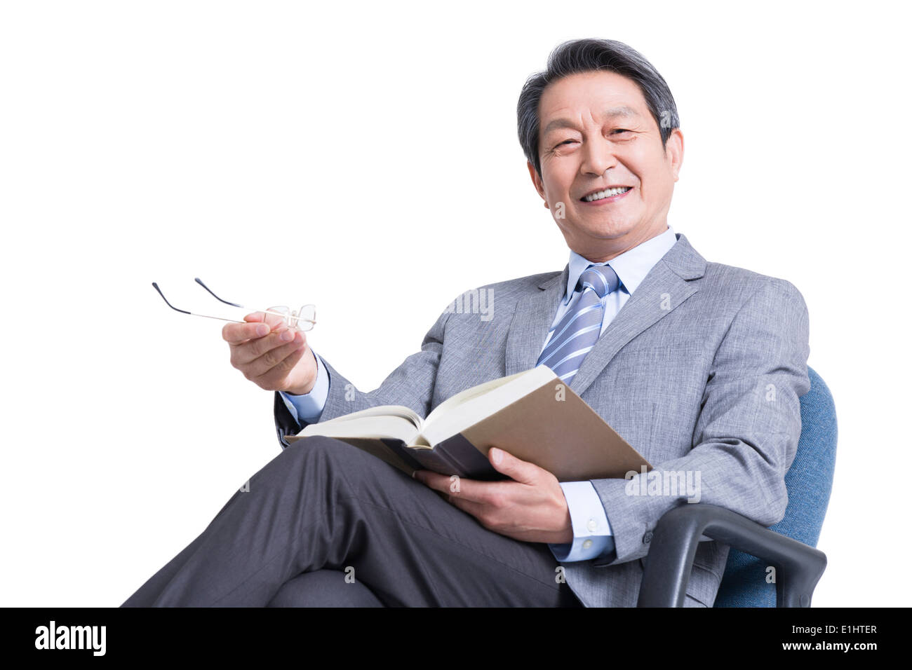 Happy senior man reading book Stock Photo - Alamy