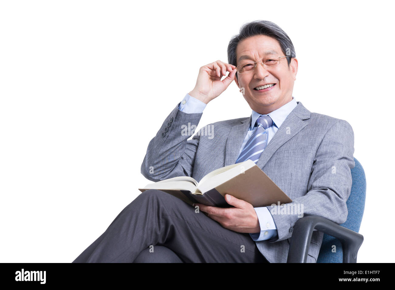 Happy senior man reading book Stock Photo - Alamy