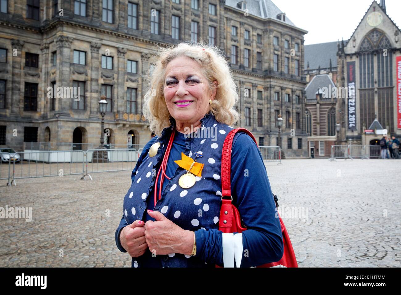 Dutch artist Marte Roling posing with the honor medal of Orange in ...