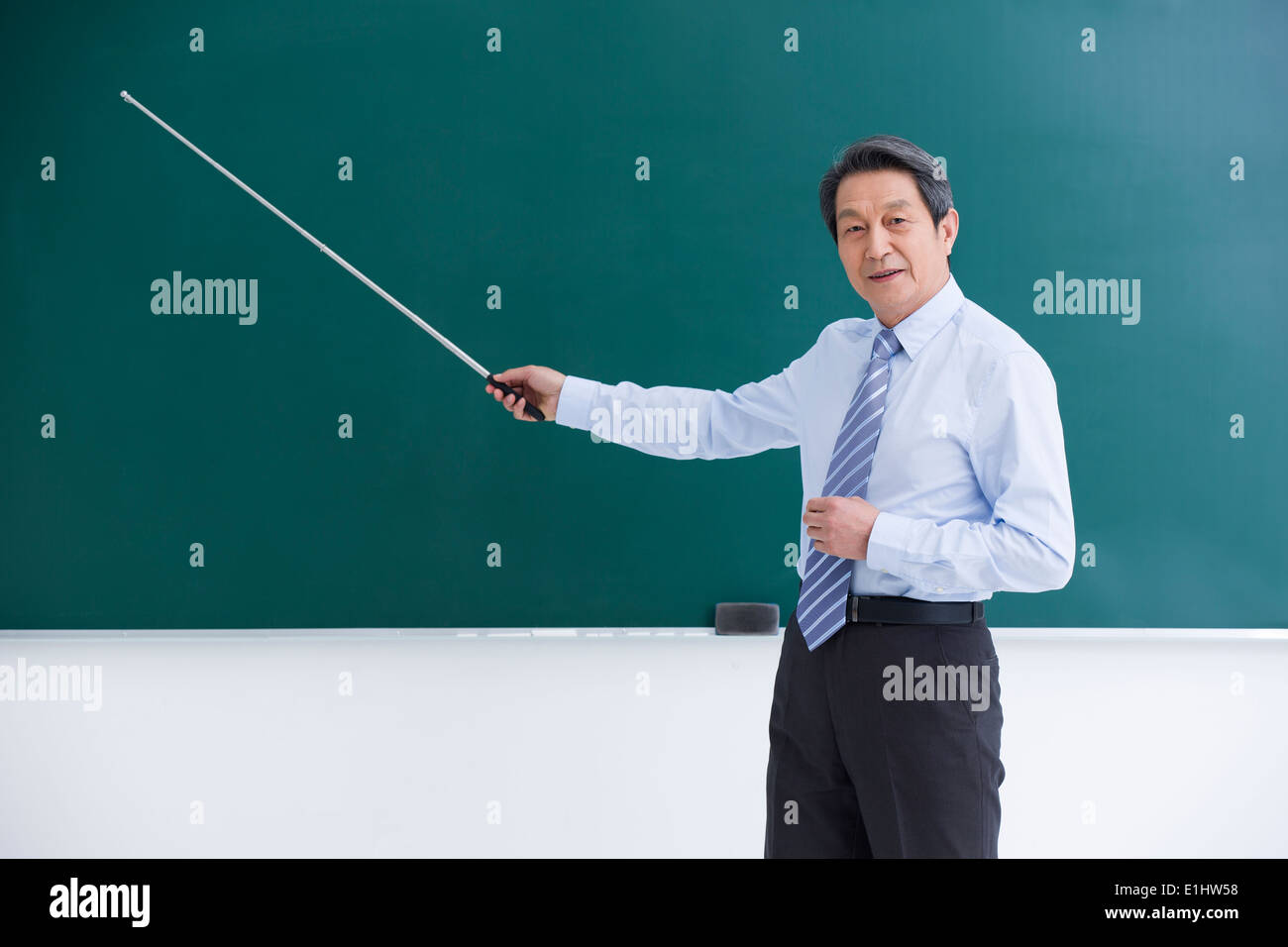 Professor teaching in classroom Stock Photo - Alamy