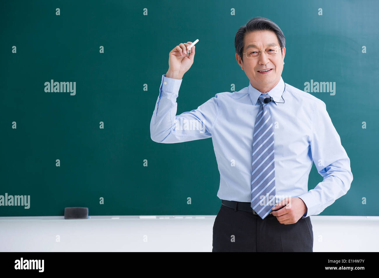 Professor teaching in classroom Stock Photo - Alamy