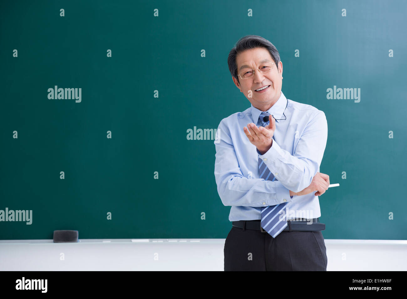 Professor teaching in classroom Stock Photo - Alamy