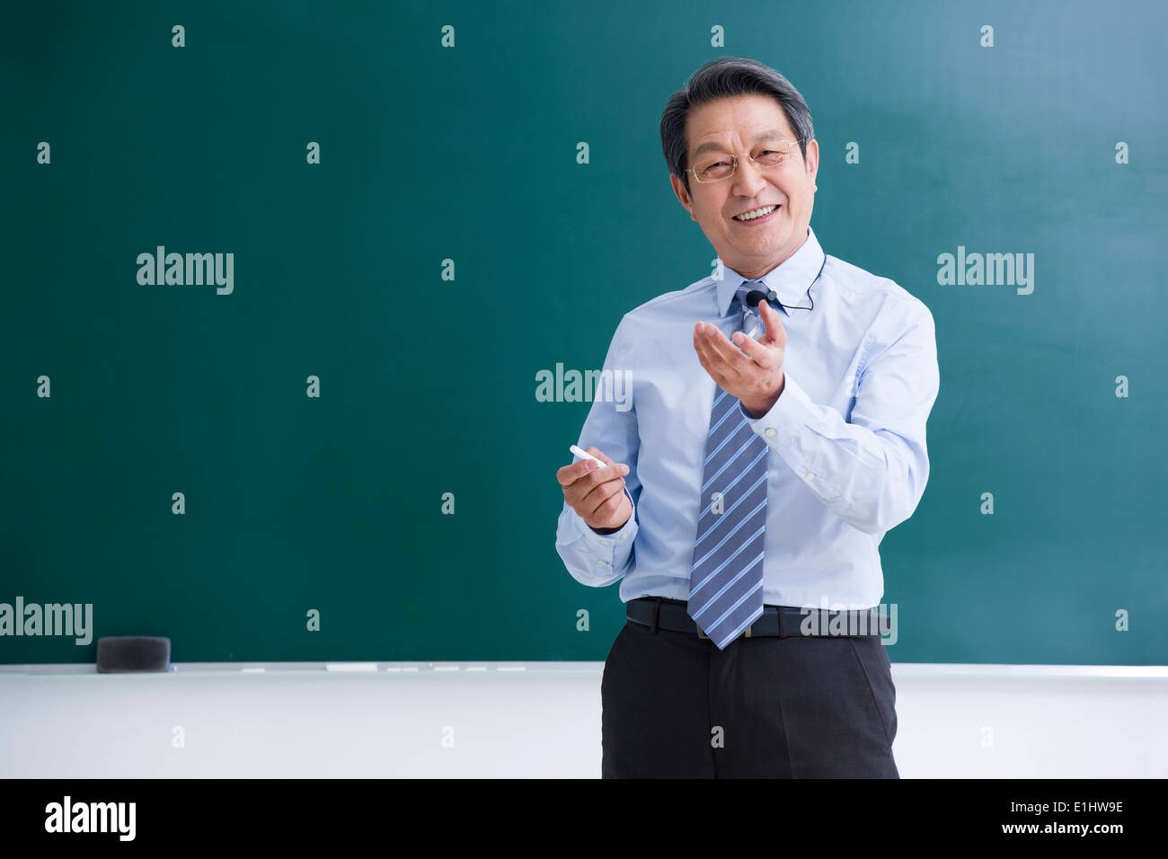 Professor teaching in classroom Stock Photo - Alamy