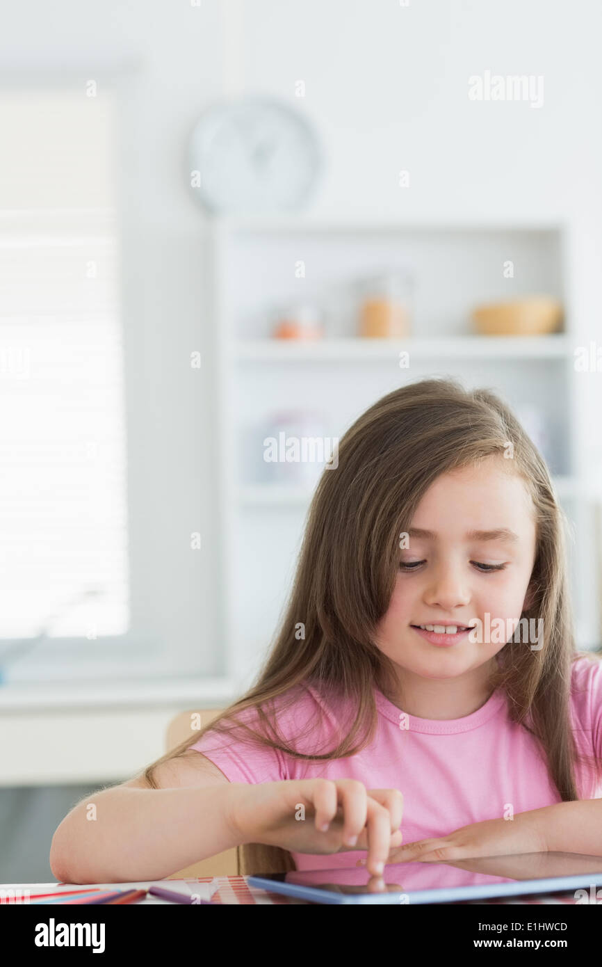 Little girl using tablet Stock Photo - Alamy