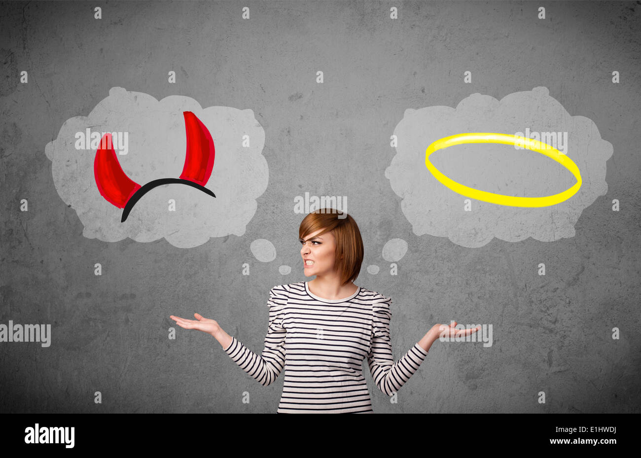 Woman choosing between good and bad Stock Photo - Alamy