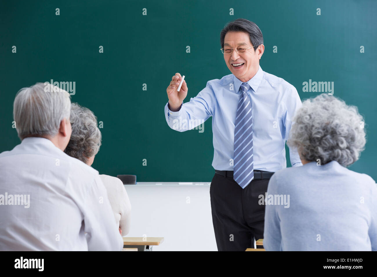 Senior adults having class at school Stock Photo - Alamy