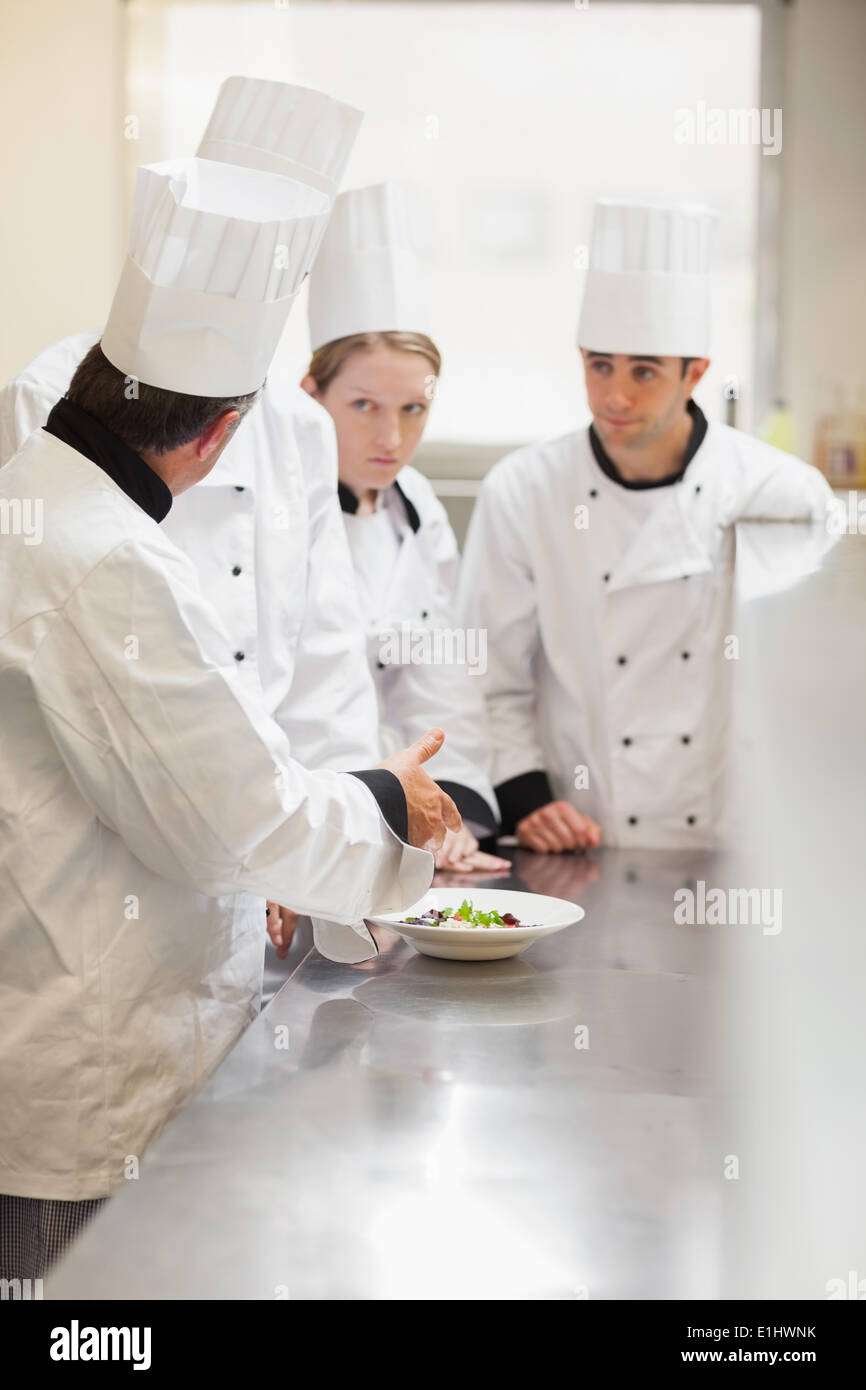 Head chef explaining something to class Stock Photo - Alamy
