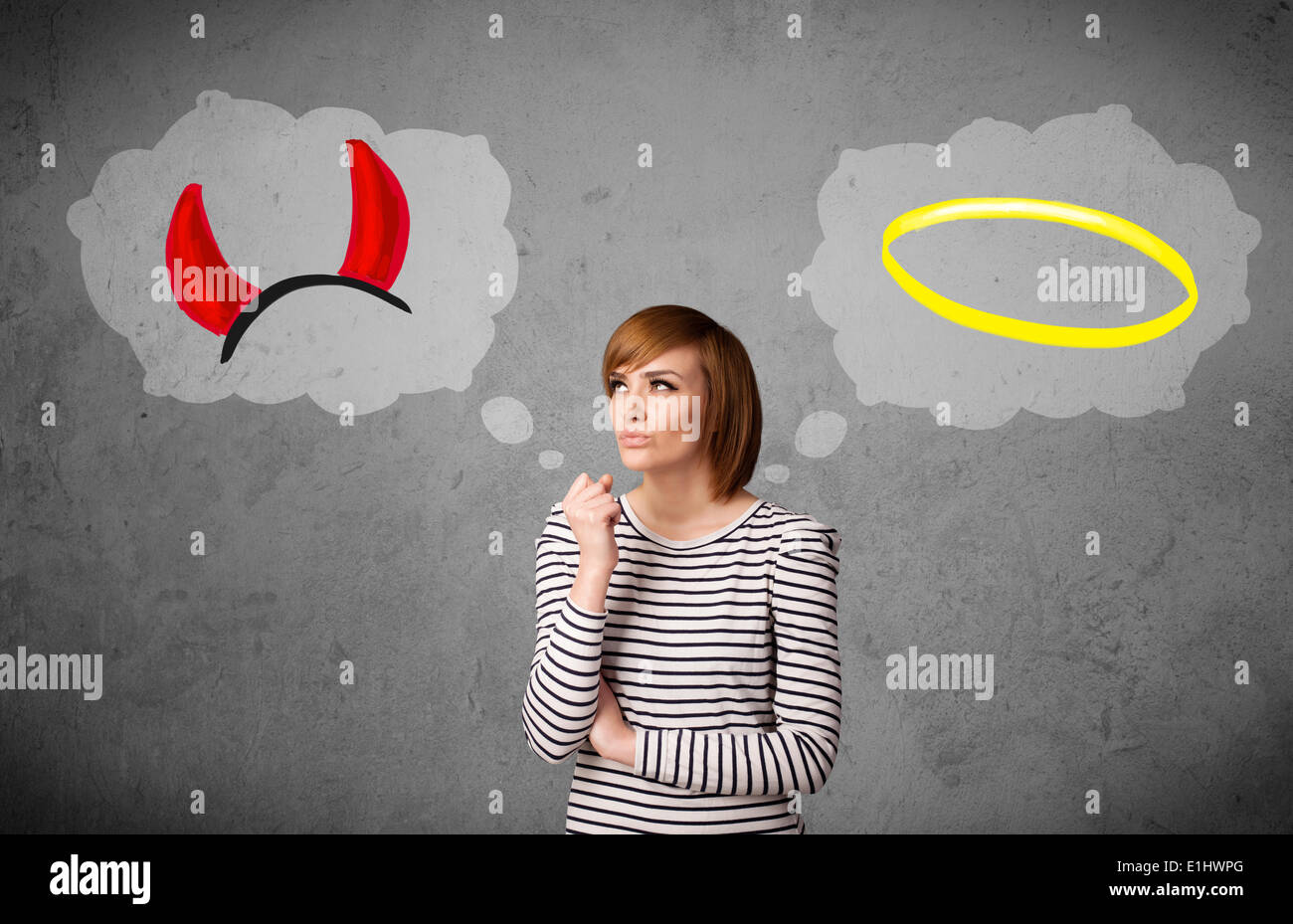 Woman choosing between good and bad Stock Photo - Alamy