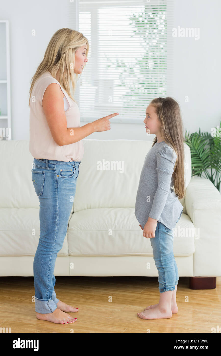 Mother giving out to daughter Stock Photo - Alamy