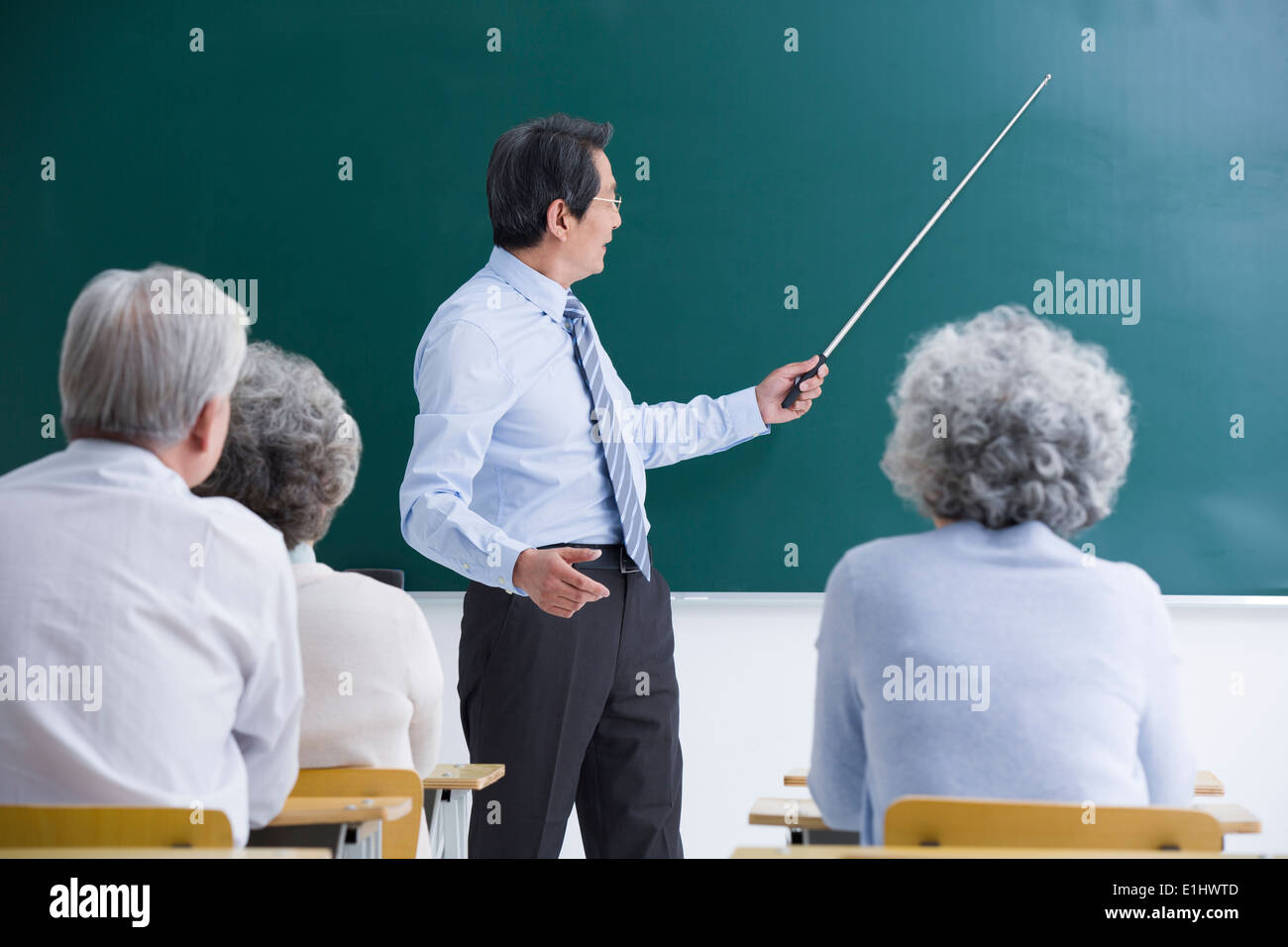 Senior adults having class at school Stock Photo - Alamy